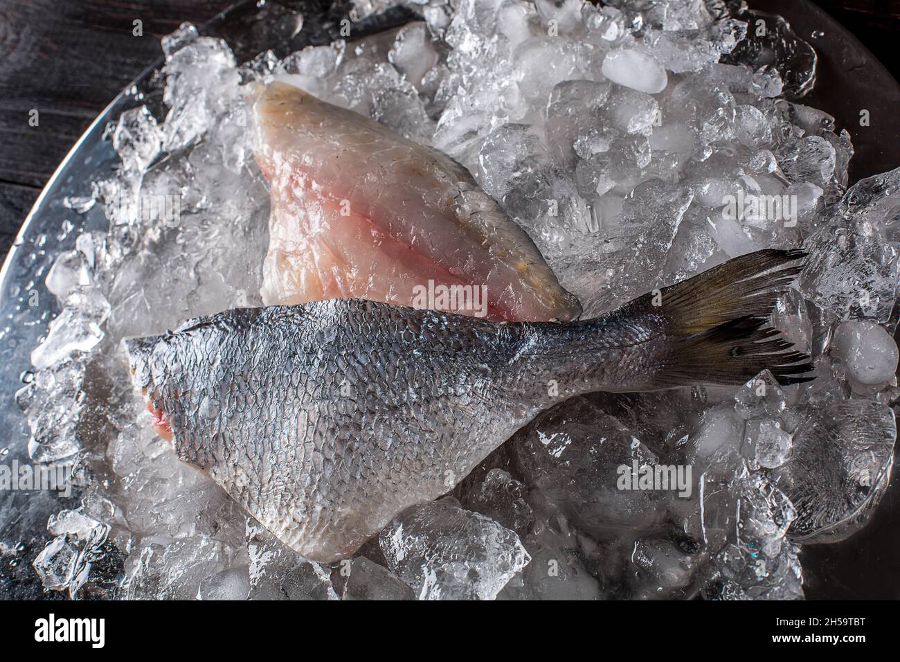 Seafood cooking preparation. Top view of dorado fillet on ice Stock ...