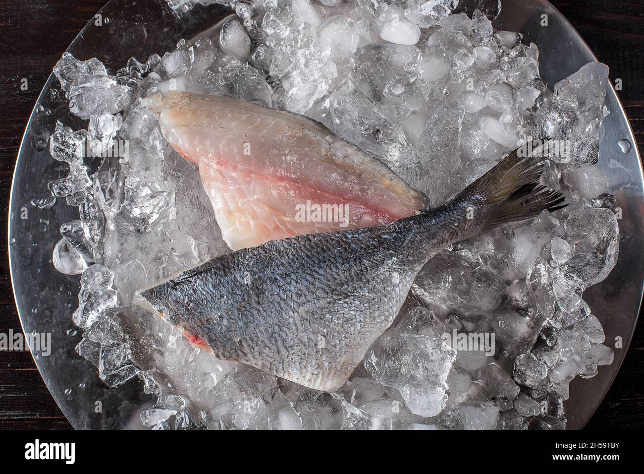 Seafood cooking preparation. Top view of dorado fillet on ice Stock ...