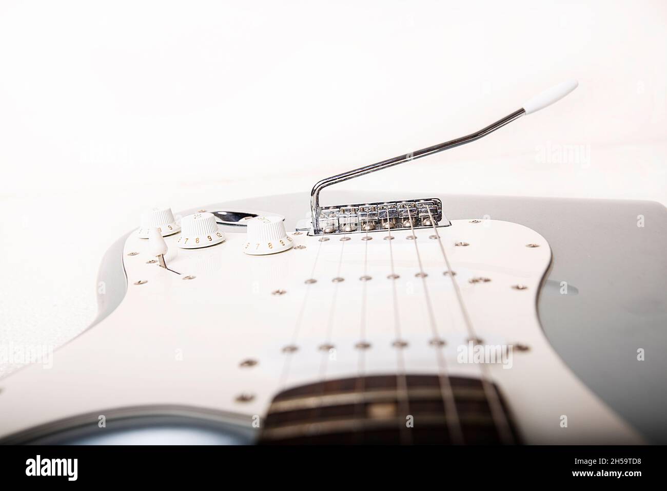 Silver electric guitar isolated on white background Stock Photo - Alamy