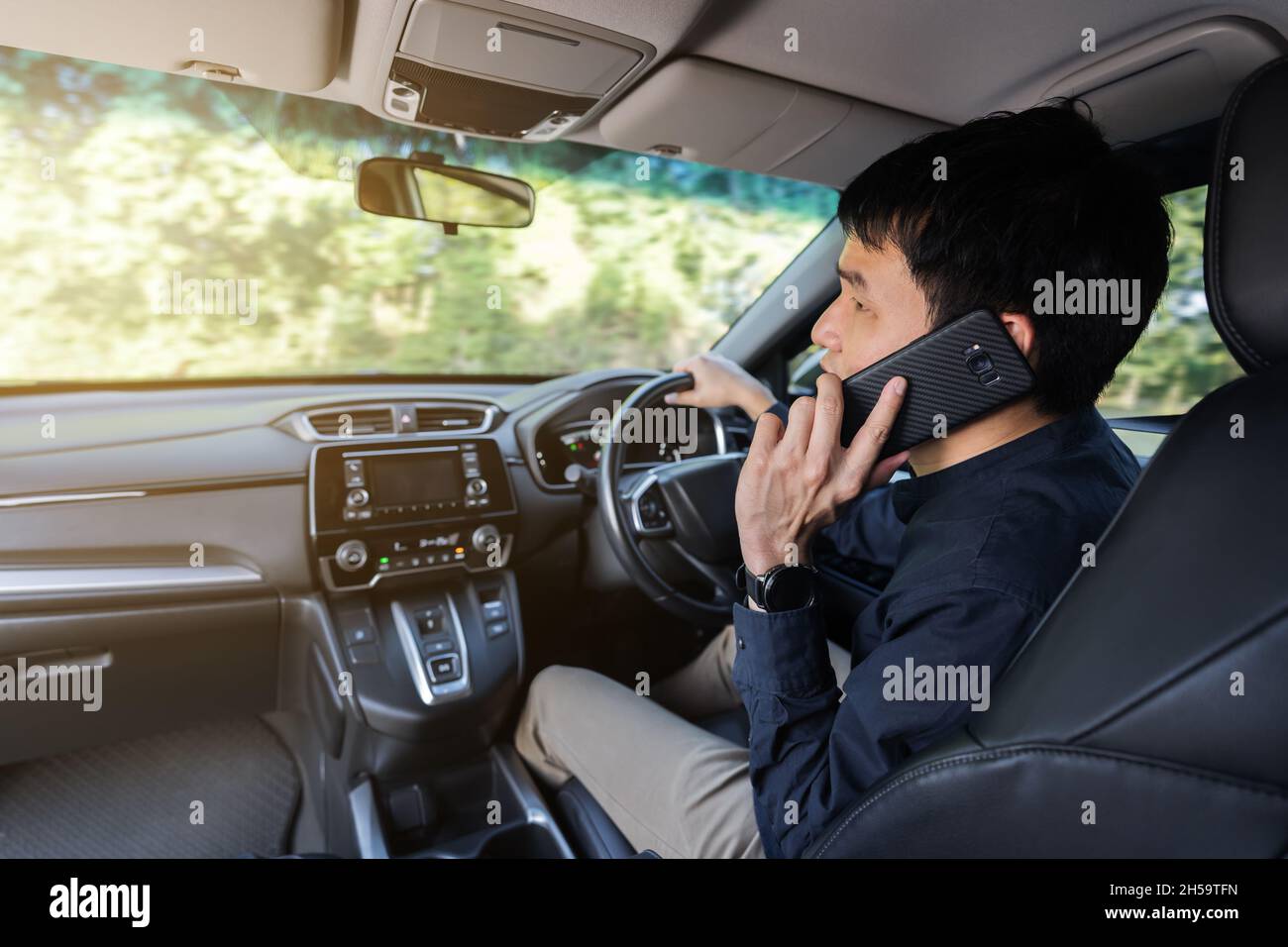 Driving mobile speaking hi-res stock photography and images - Alamy