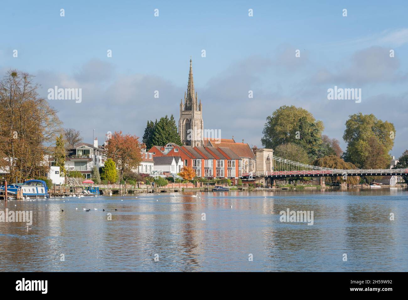 All Saint's Church and Marlow suspension bridge next to the River ...
