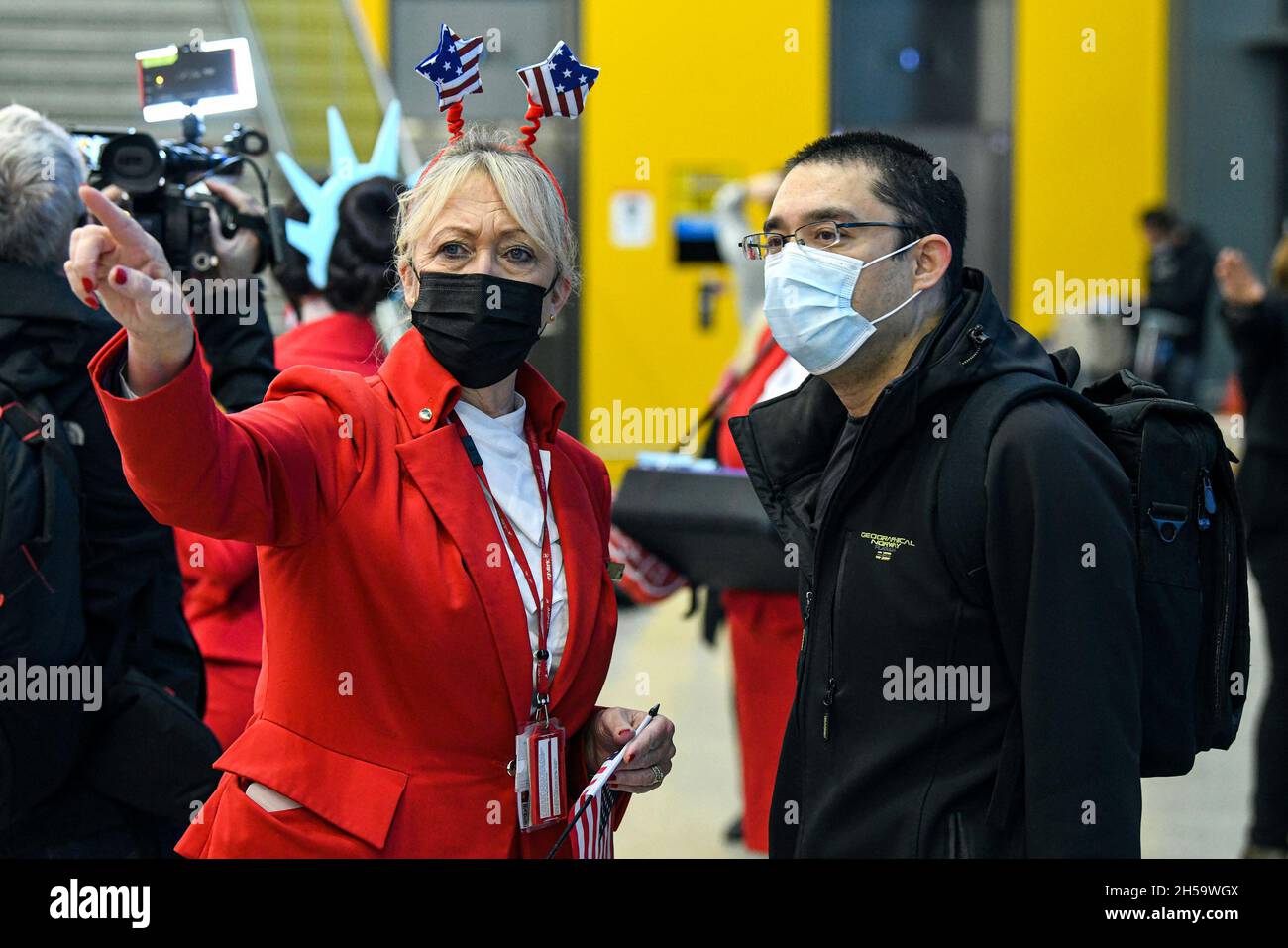 EDITORIAL USE ONLY Virgin Atlantic staff assist passengers at London ...
