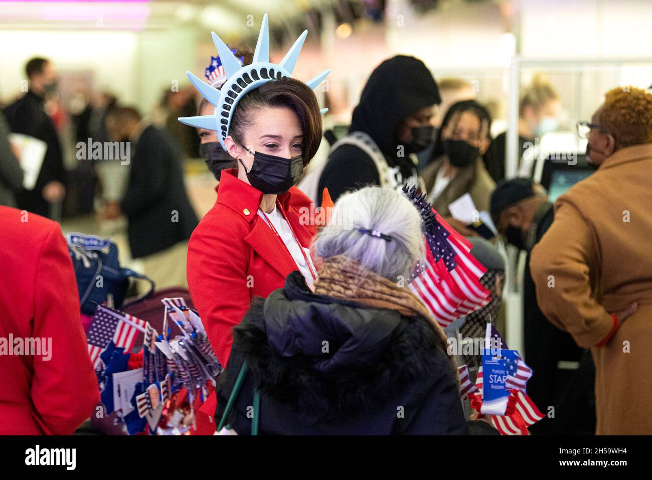 EDITORIAL USE ONLY Virgin Atlantic staff assist passengers at London ...