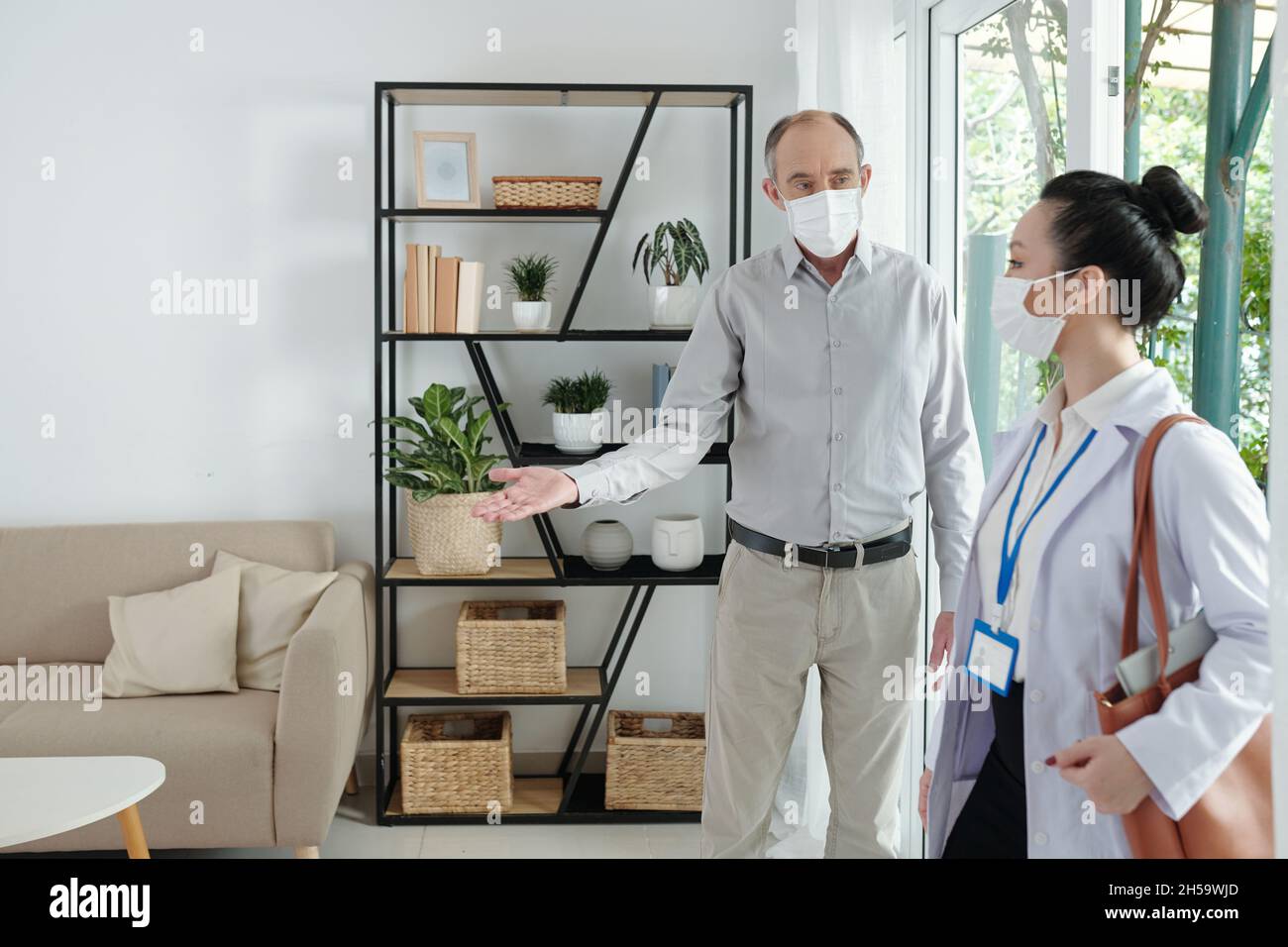 Welcome in house gesture hi-res stock photography and images - Alamy