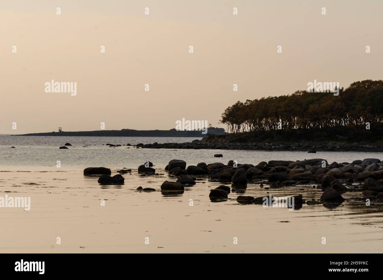 Stones in the water. Sea harbor Stock Photo - Alamy
