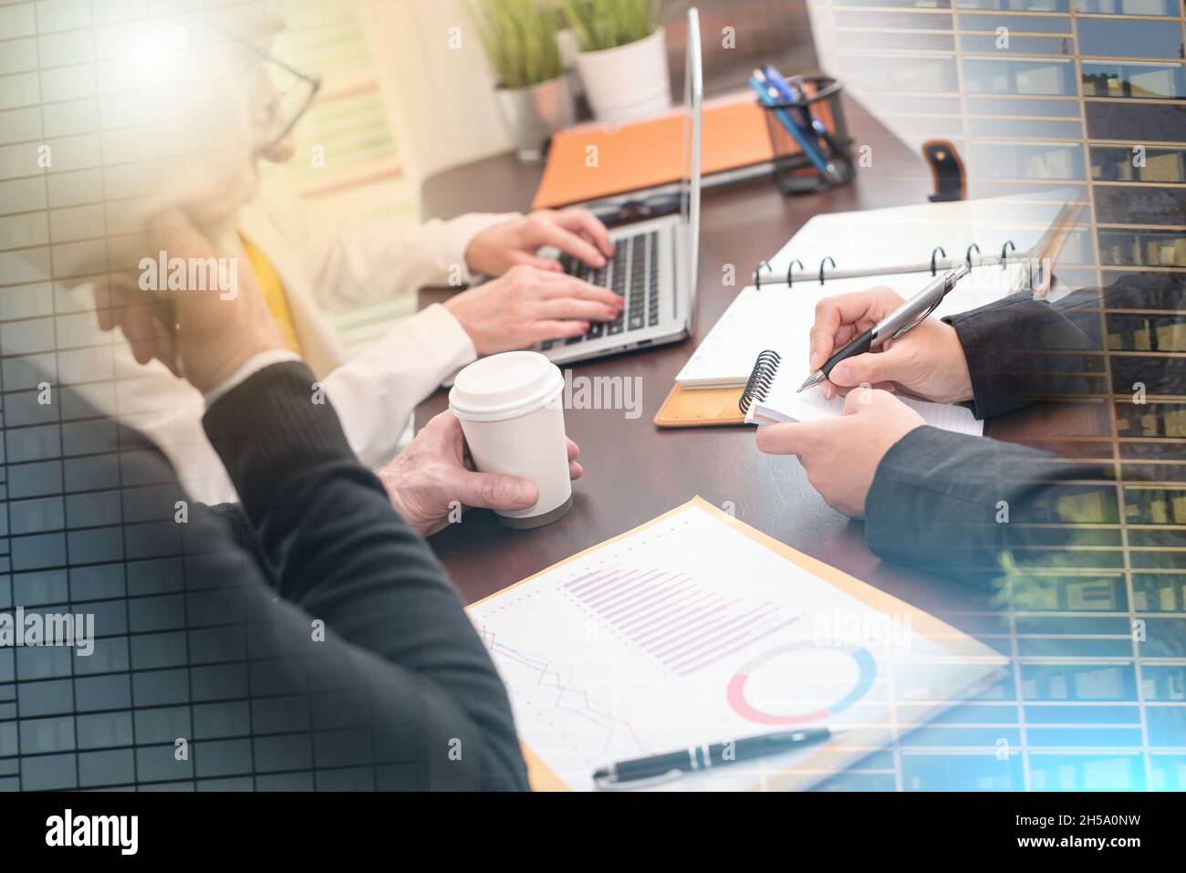 Group of three people working together. teamwork concept; multiple ...