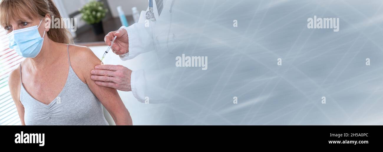 Doctor giving vaccin injection to female patient in medical office ...
