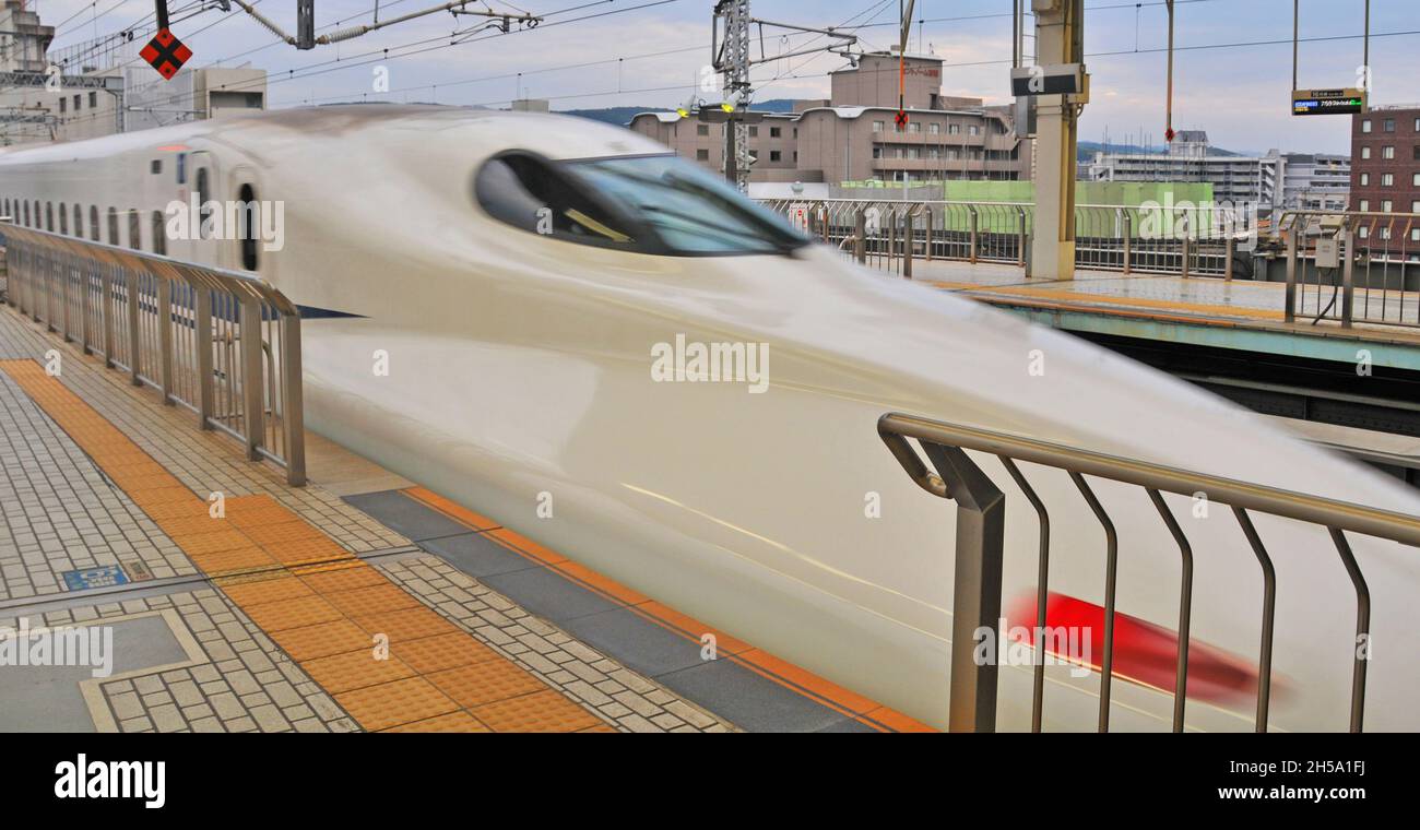 Shinkansen bullet train entering in Kyoto railway station, Japan Stock ...