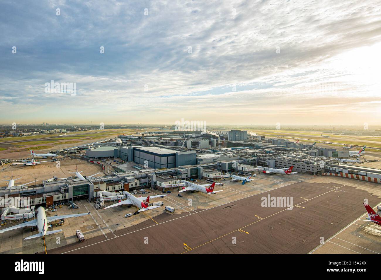 EDITORIAL USE ONLY British Airways flight BA001 (left runway) and ...