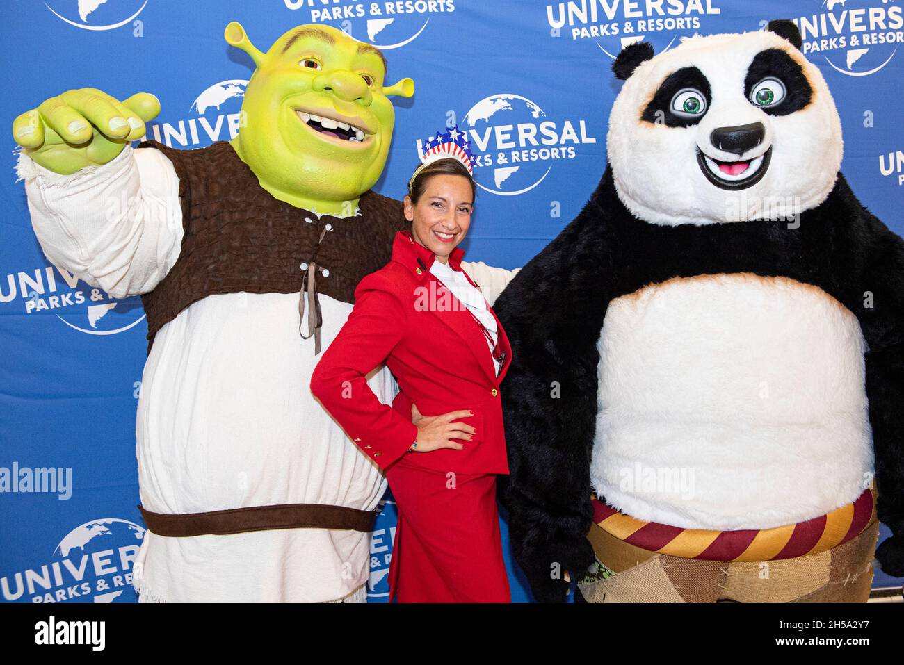EDITORIAL USE ONLY Virgin Atlantic staff pose with Universal characters ...