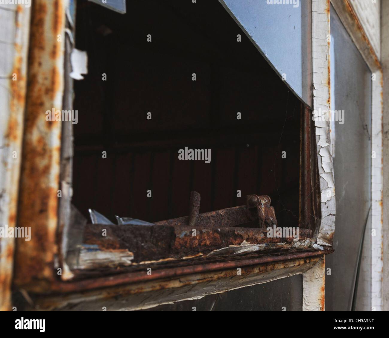 broken window on an old garage in the UK Stock Photo - Alamy