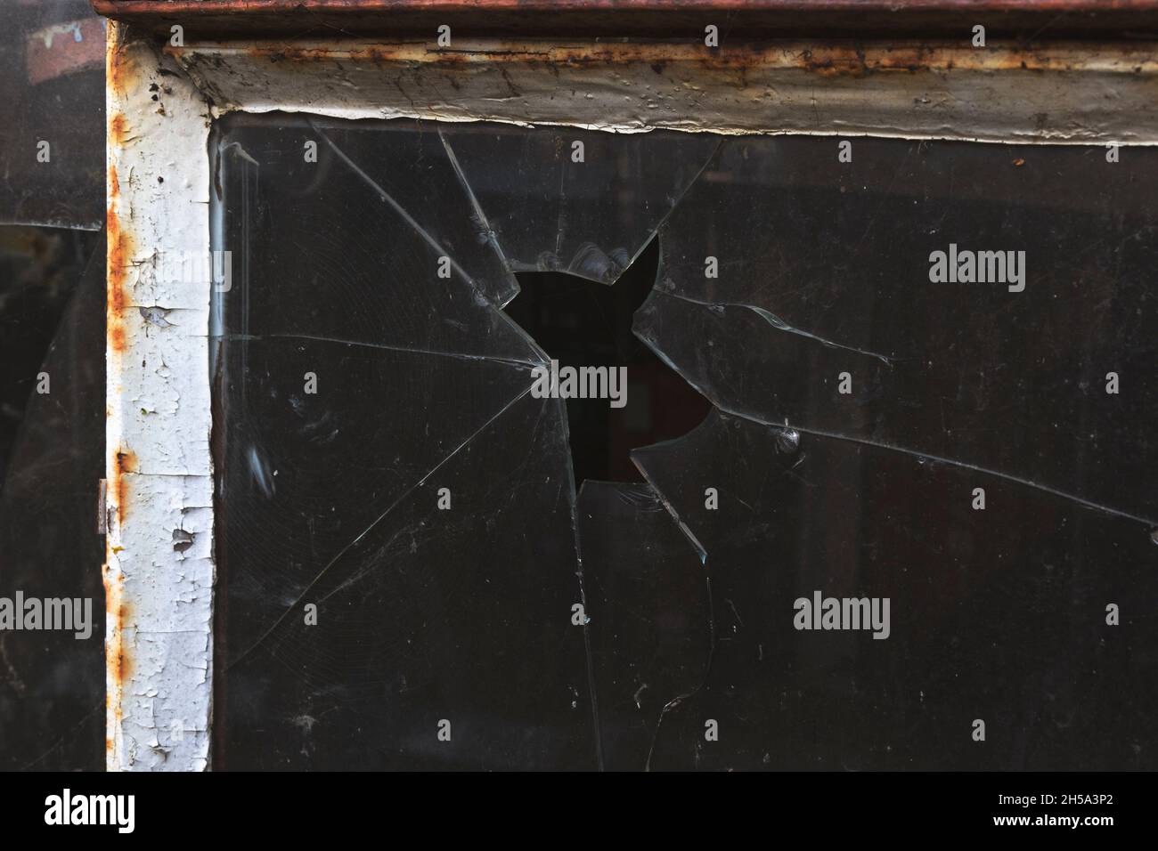 broken window on an old garage in the UK Stock Photo - Alamy