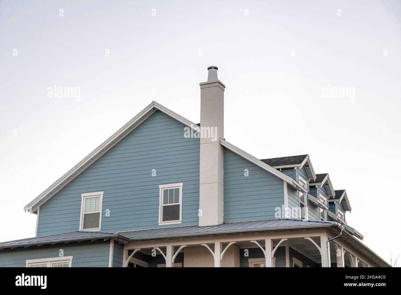 Side view of a cape cod home against the white sky background Stock ...