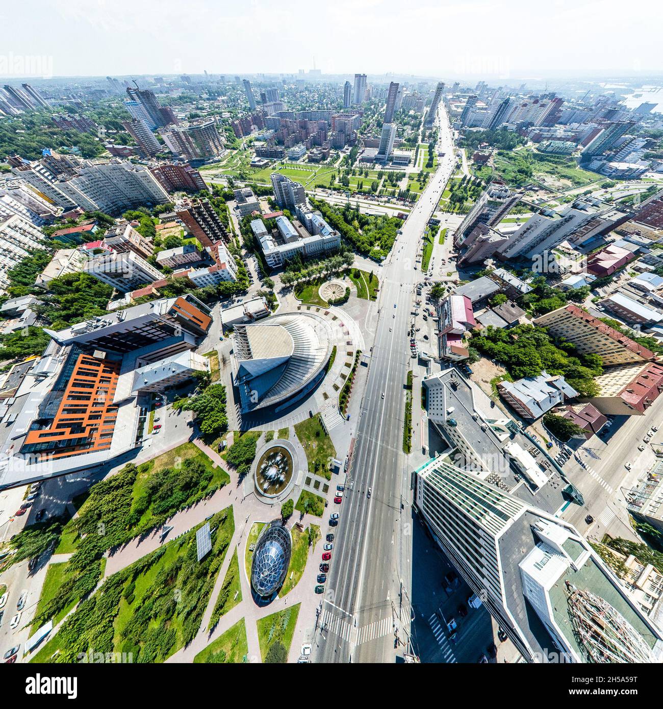Aerial city view with crossroads, roads, houses, buildings, parks and ...