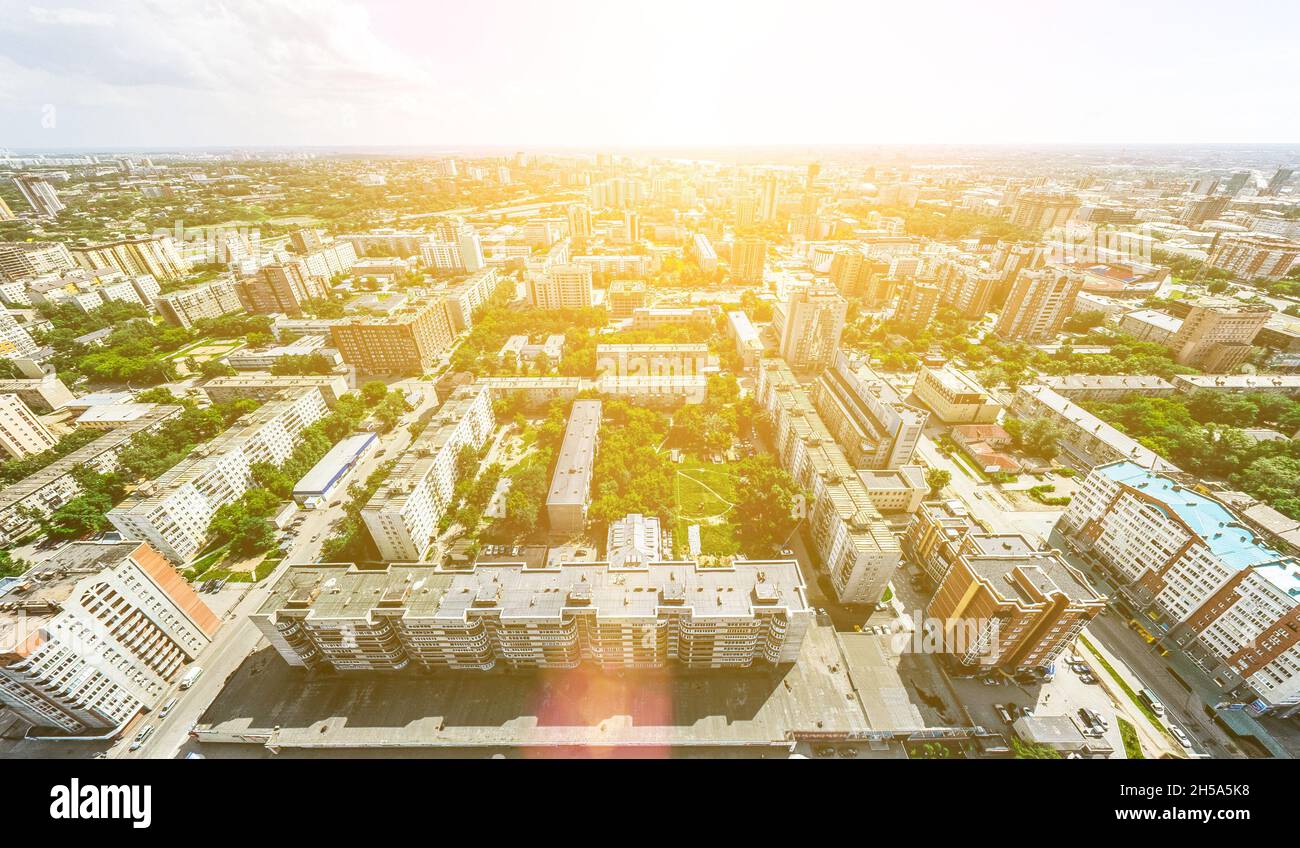 Aerial city view with crossroads and roads, houses, buildings, parks ...
