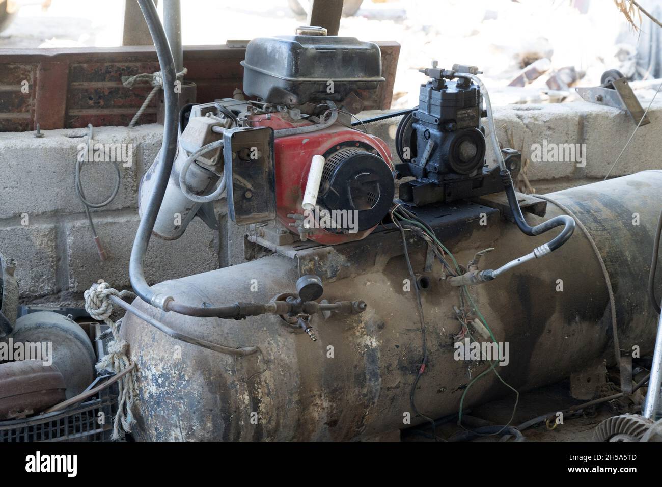 old rusted air compressor in baja california sur mexico Stock Photo - Alamy
