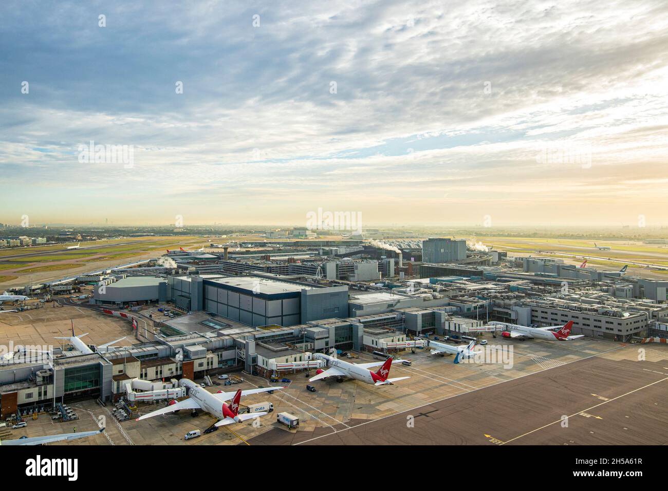 EDITORIAL USE ONLY British Airways flight BA001 (left runway) and ...