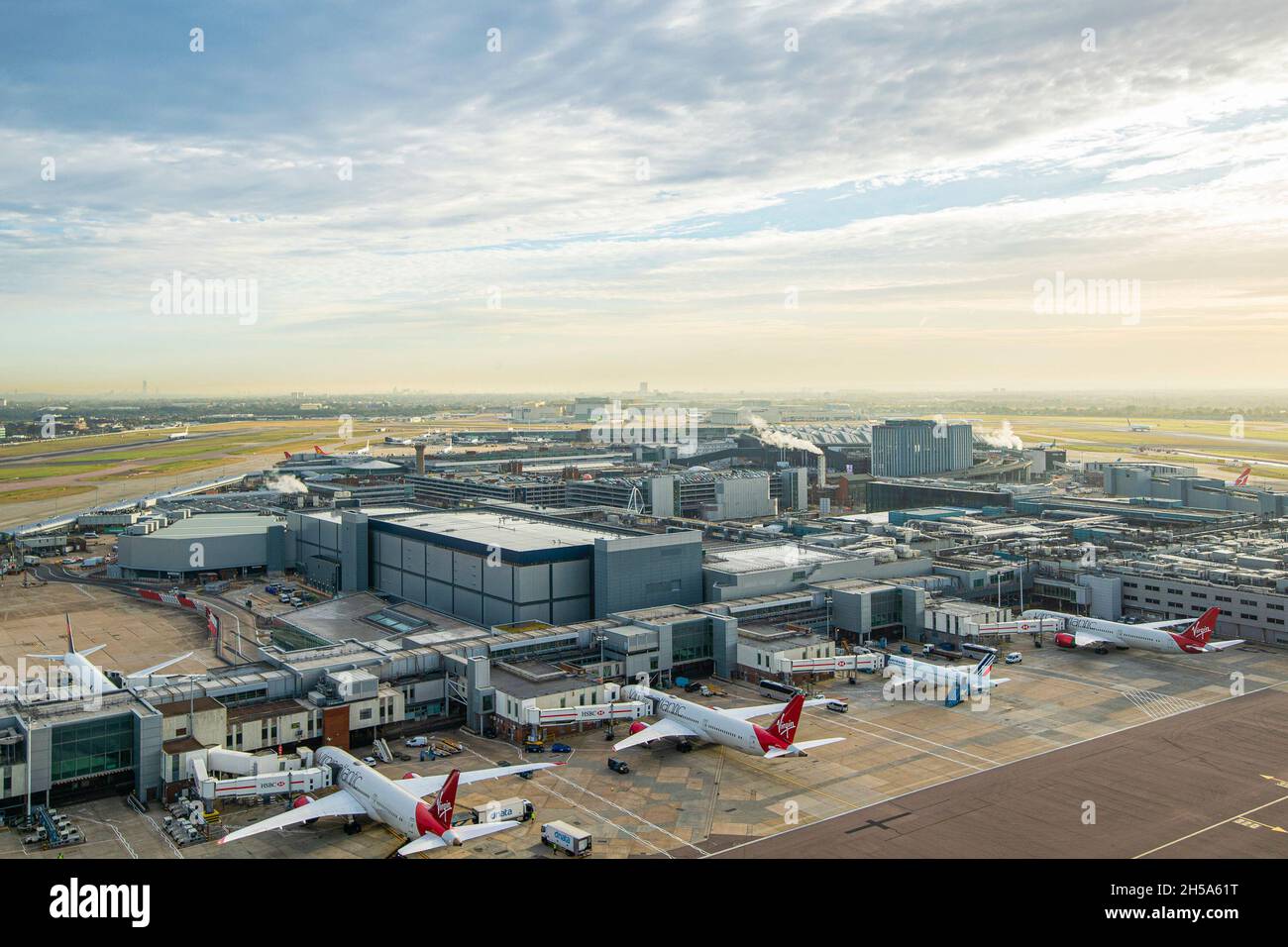 EDITORIAL USE ONLY British Airways flight BA001 (left runway) and ...