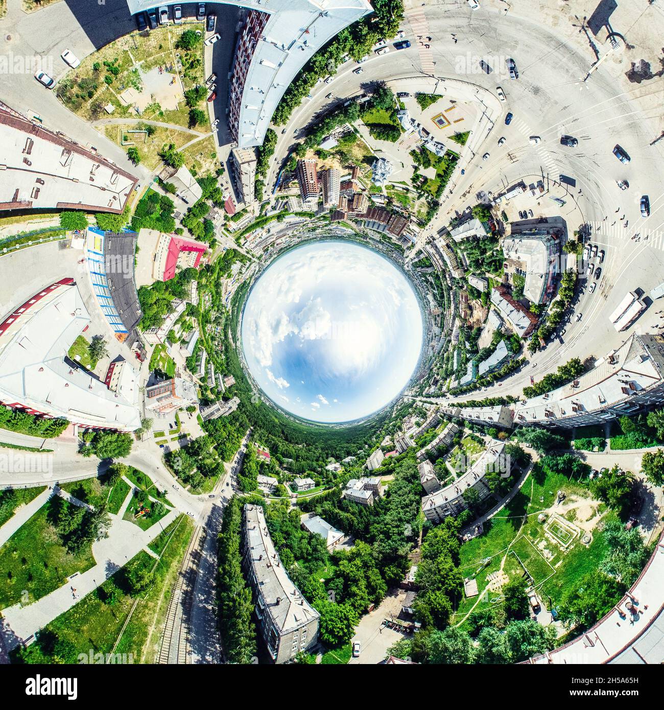 Aerial city view with crossroads and roads, houses, buildings, parks ...