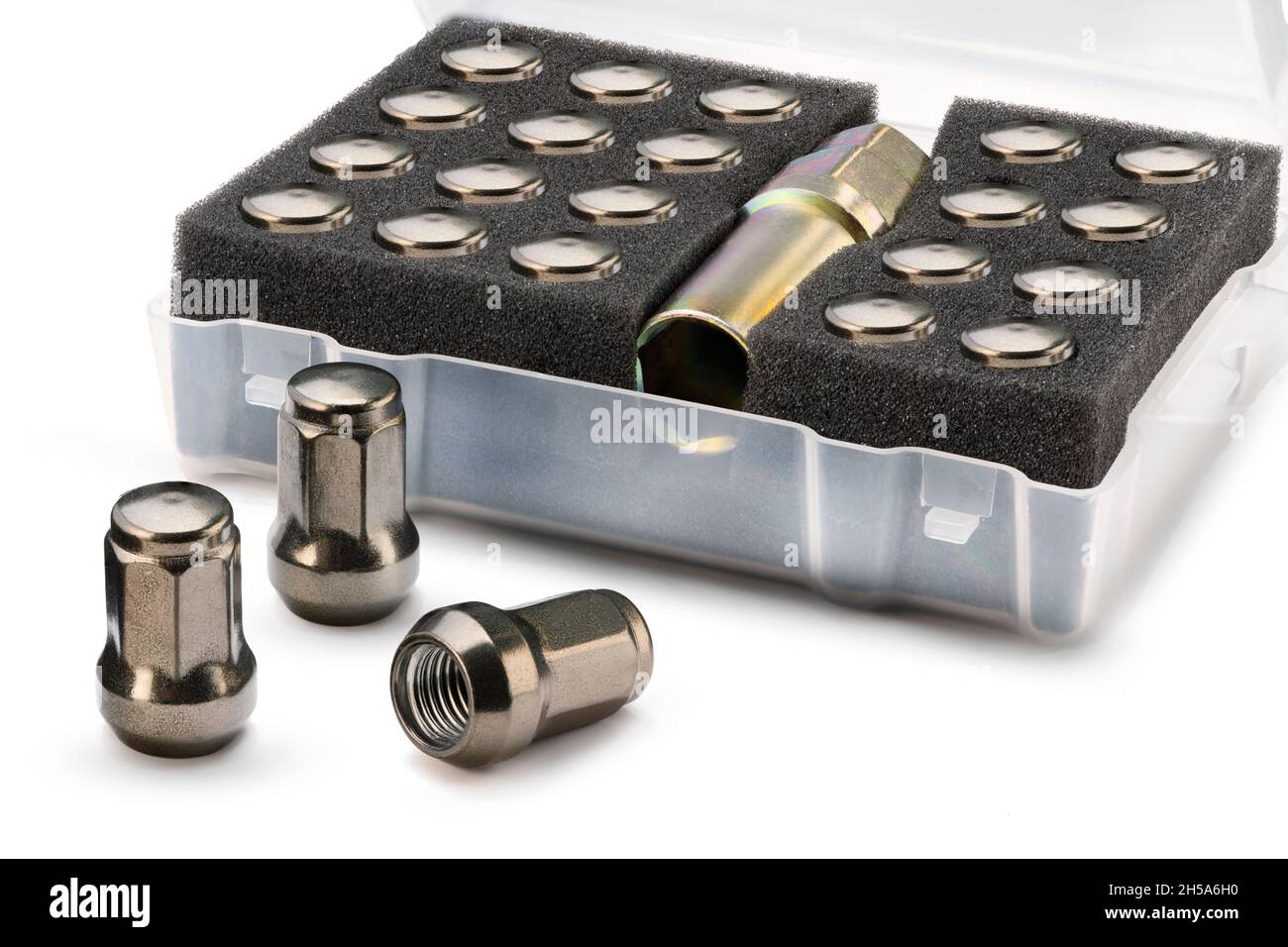 seven-sided wheel nuts a set of mounting bolts isolate on a white ...