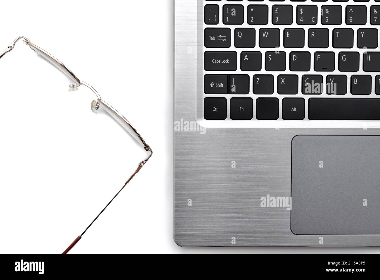 Glasses and laptop computer keyboard. Vision problems at work with ...