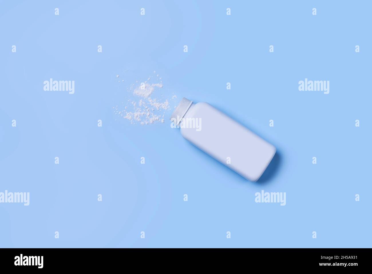 Baby powder on blue background. Top view. Baby talcum powder container ...