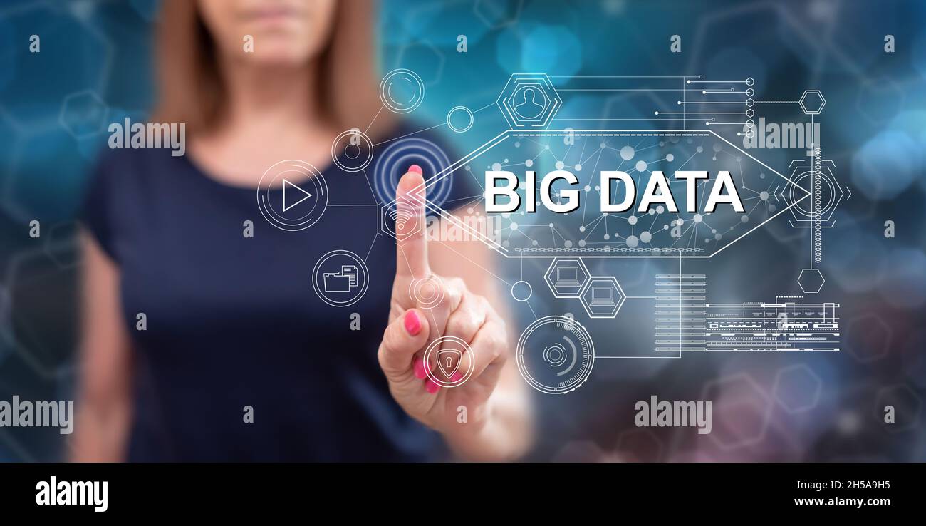 Woman touching a big data concept on a touch screen with her finger ...