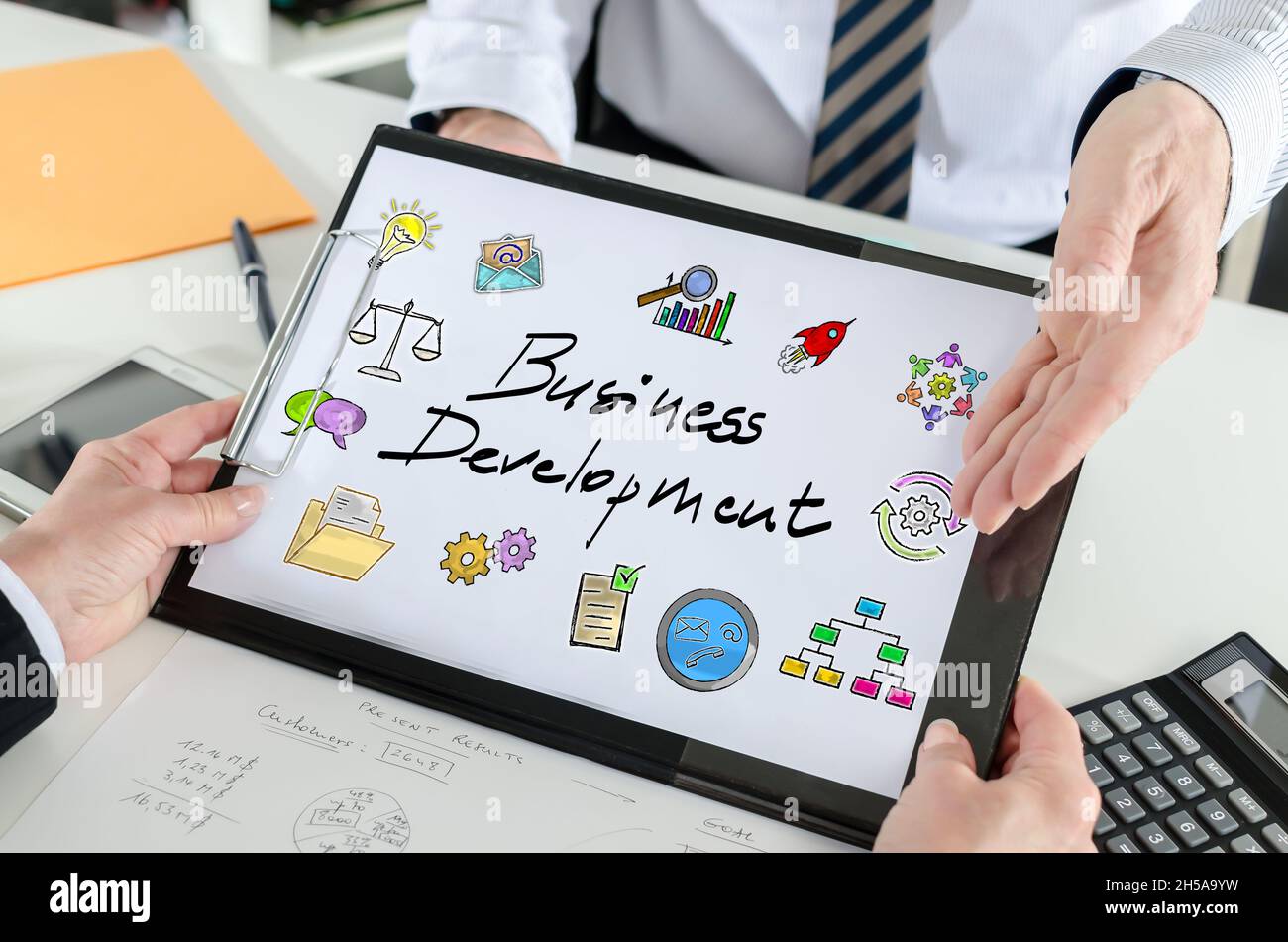 Business development concept shown by a businessman Stock Photo - Alamy