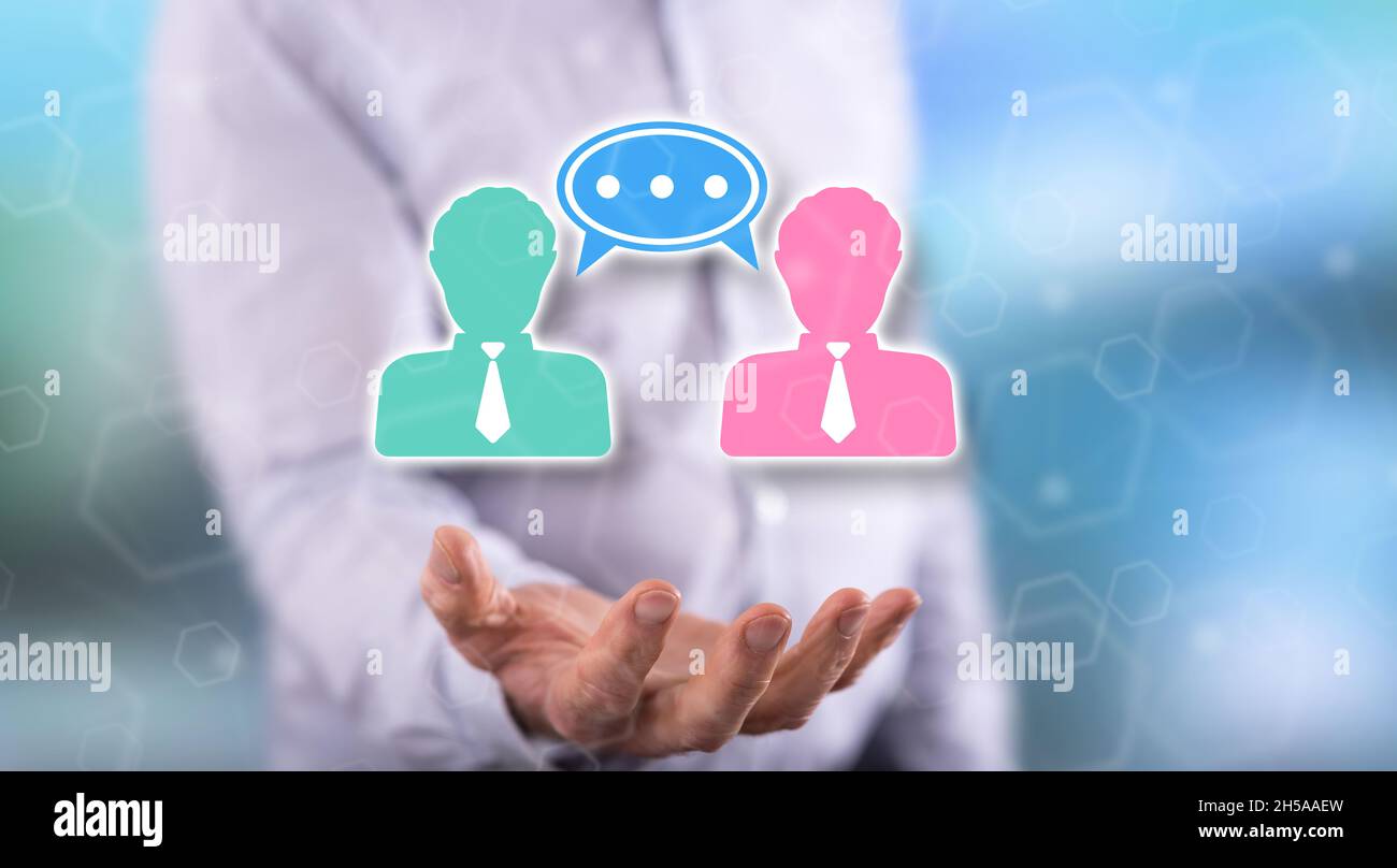 Dialogue concept above the hand of a man in background Stock Photo - Alamy