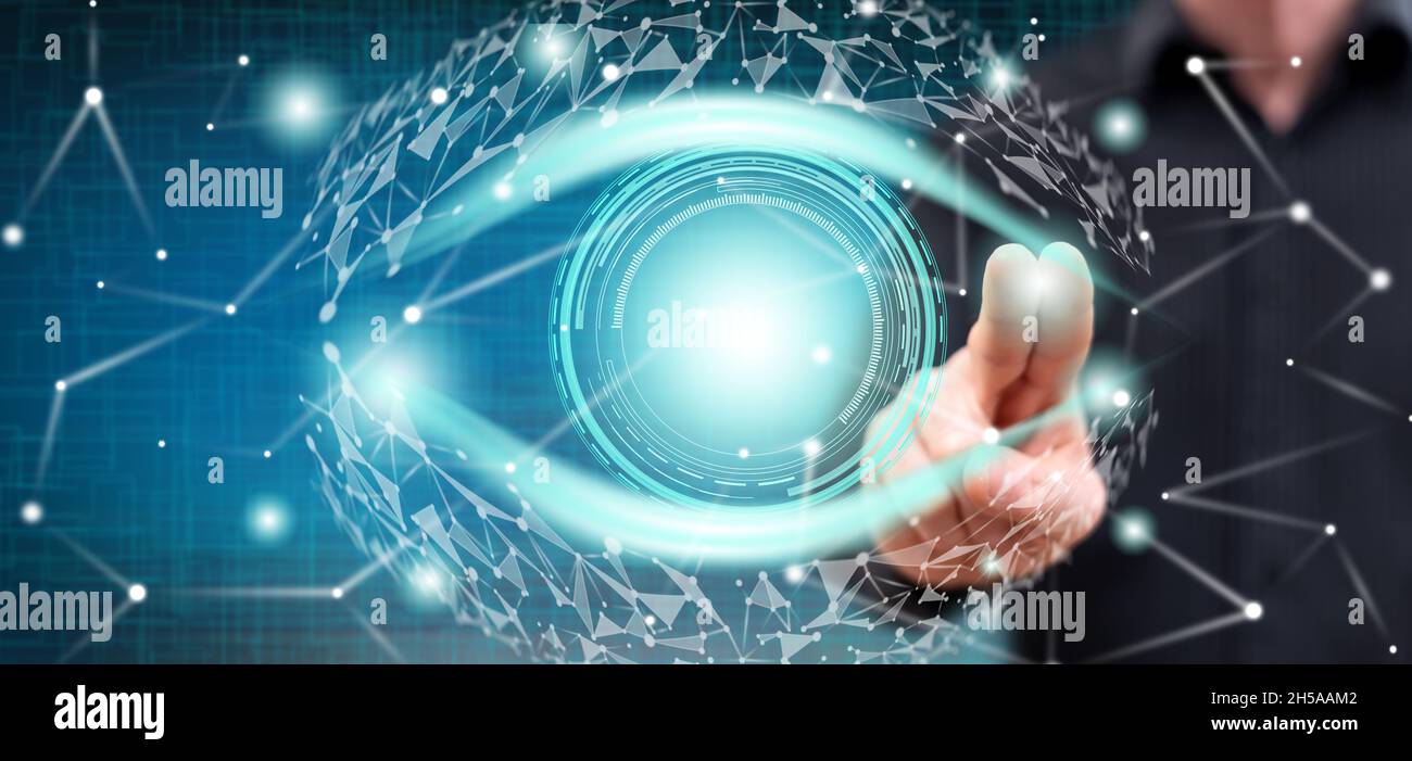 Man touching a digital eye concept on a touch screen with his fingers ...