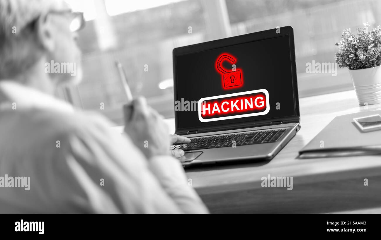 Laptop screen displaying a hacking concept Stock Photo - Alamy