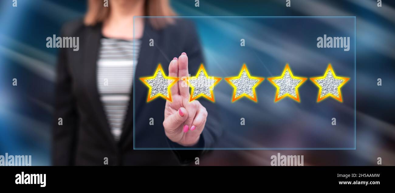 Woman touching a quality concept on a touch screen with her fingers ...