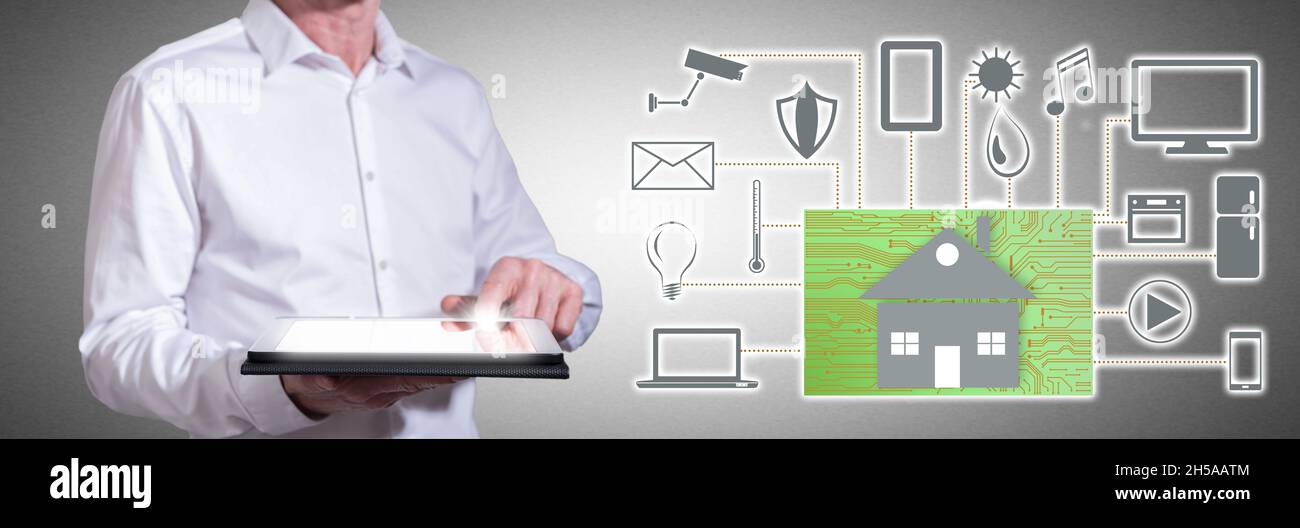 Man using a tablet with home automation concept Stock Photo - Alamy