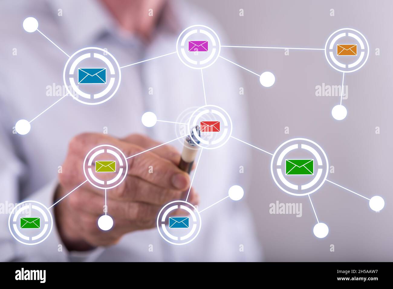 Man touching an email network on a touch screen with a pen Stock Photo ...