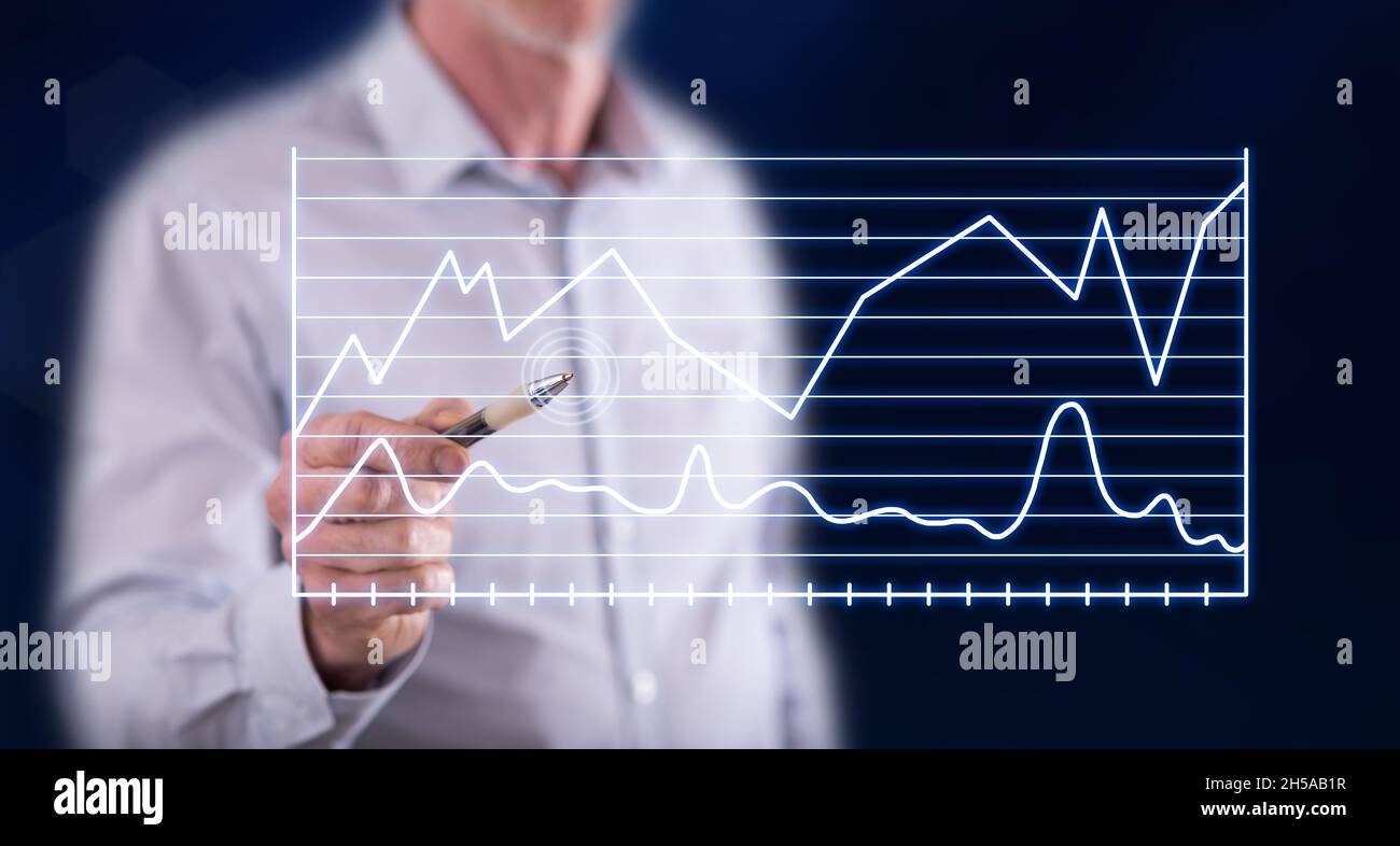 Man touching business charts on a touch screen with a pen Stock Photo ...