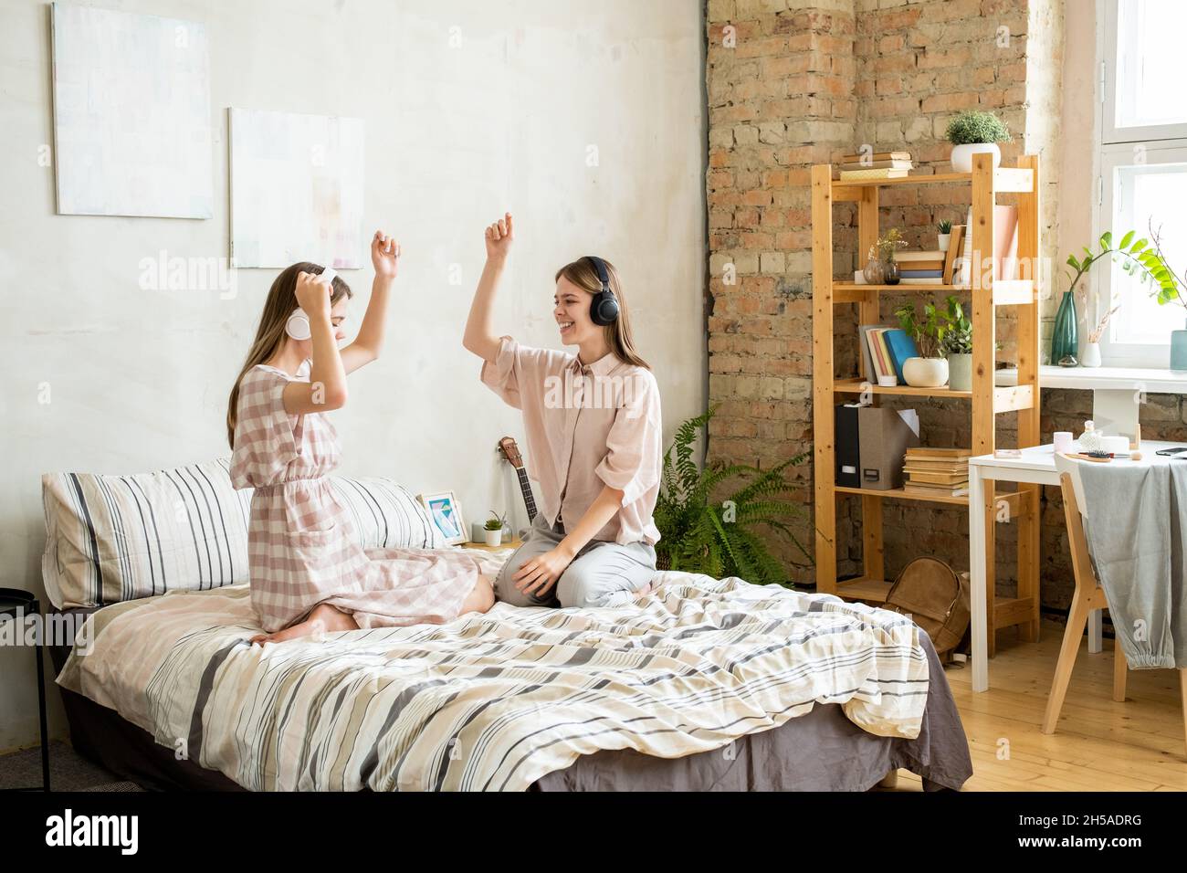 Woman dancing on bed hi-res stock photography and images - Alamy