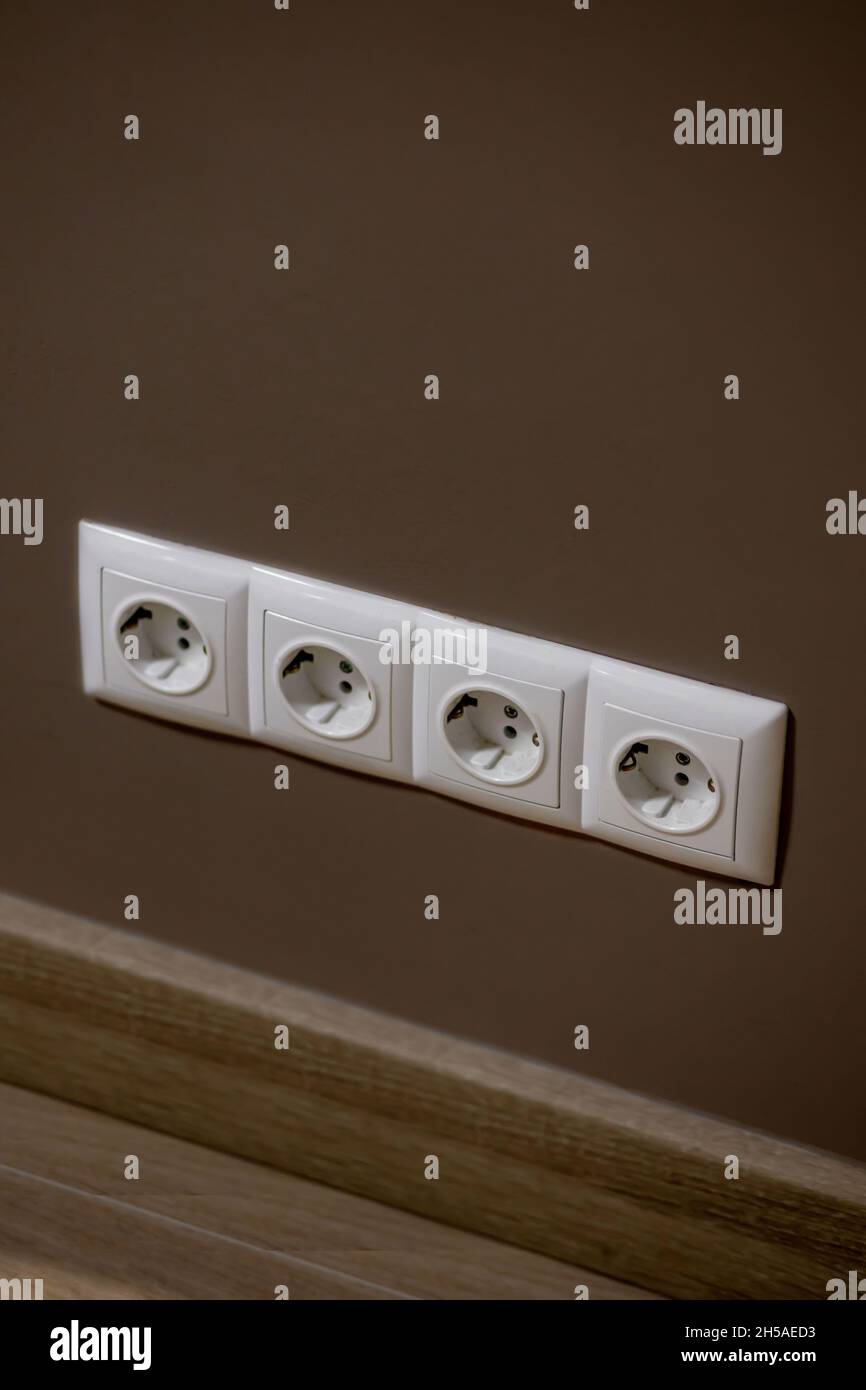 Set of three sockets on the wall. Sockets for electrical appliances ...