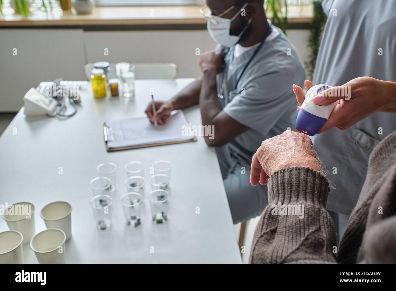 Doctor giving medical equipment hi-res stock photography and images - Alamy