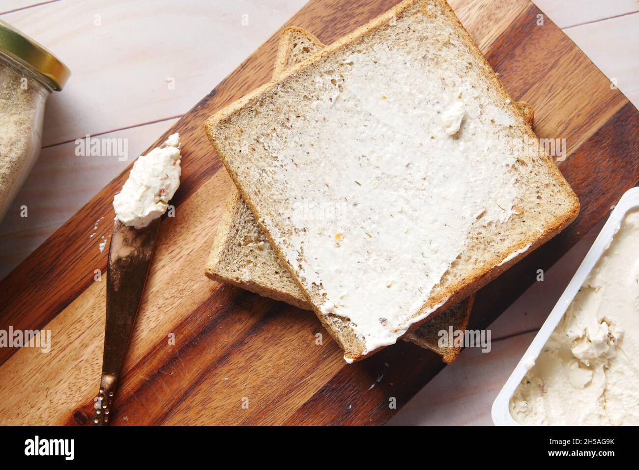 low fact cheese cream spread on a bread Stock Photo - Alamy