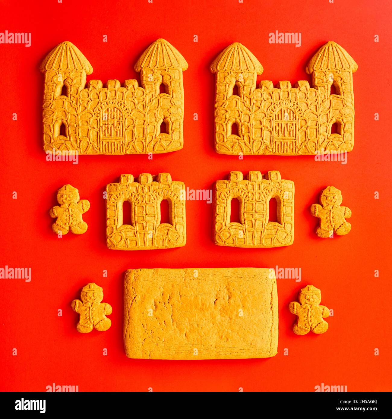 components of gingerbread castle on red background. Concept of winter ...