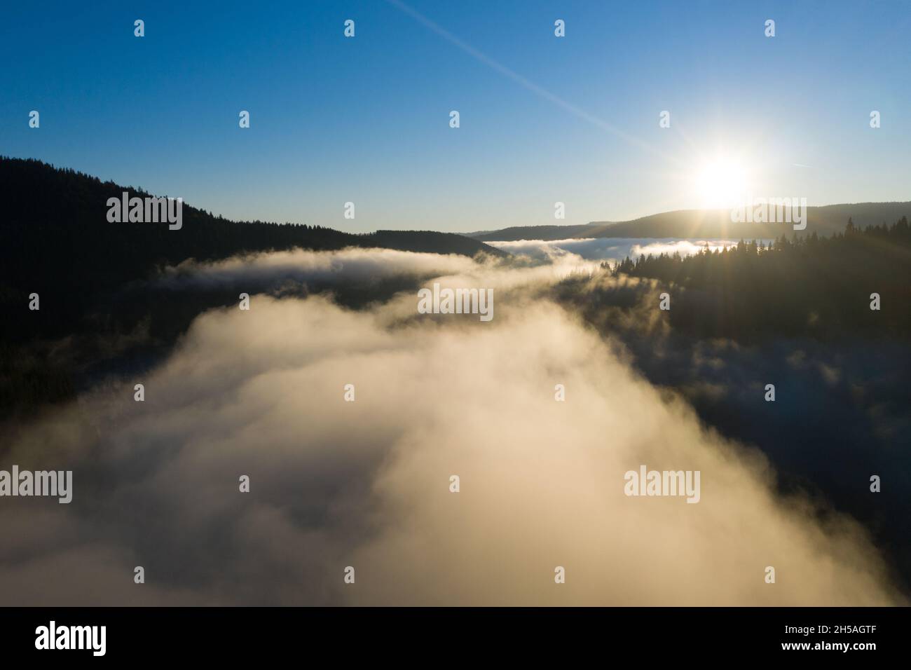 Aerial view of mountain sunrise above clouds by drone Stock Photo - Alamy