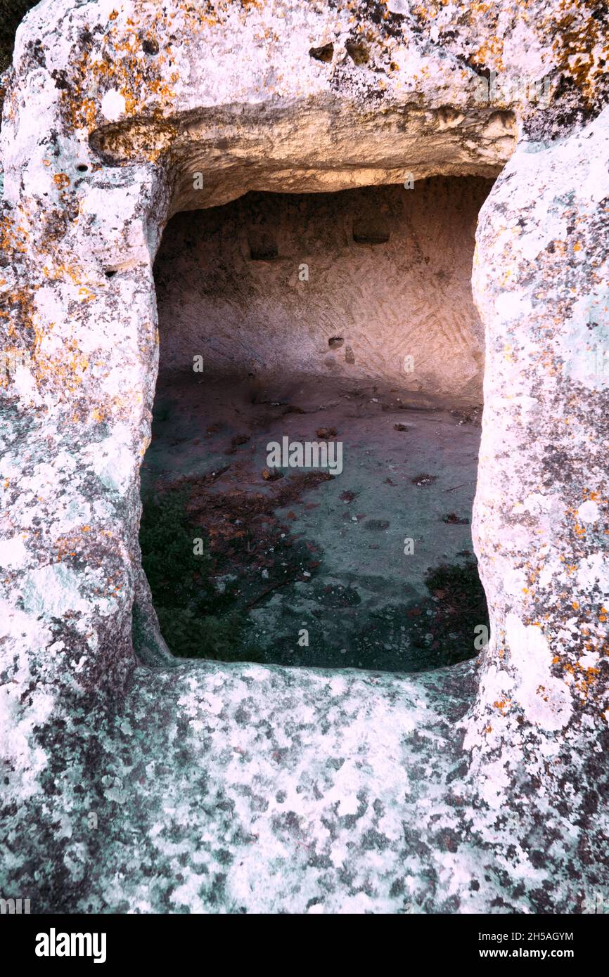 Entrance to a man-made cave in a limestone rock. A place of refuge for ...