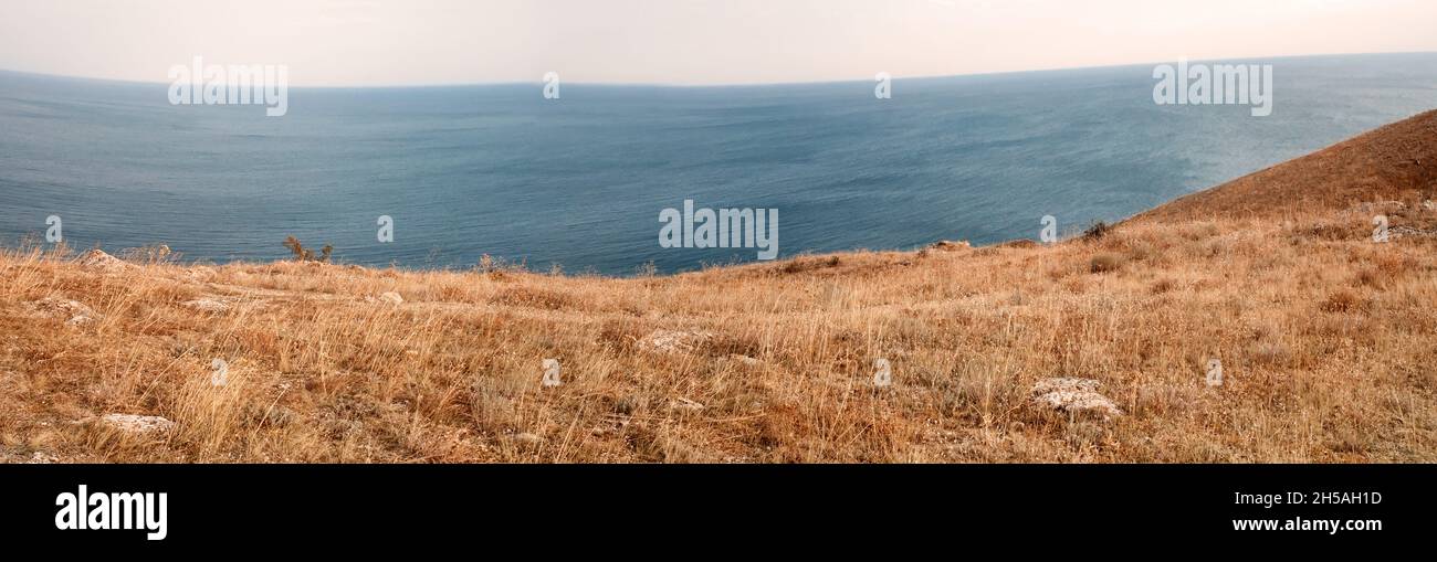 Dry autumn steppe over the cliff to the sea, Black Sea, southern part ...