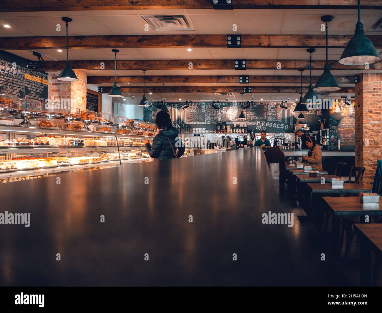 Picking out pastries at a cafe Stock Photo - Alamy