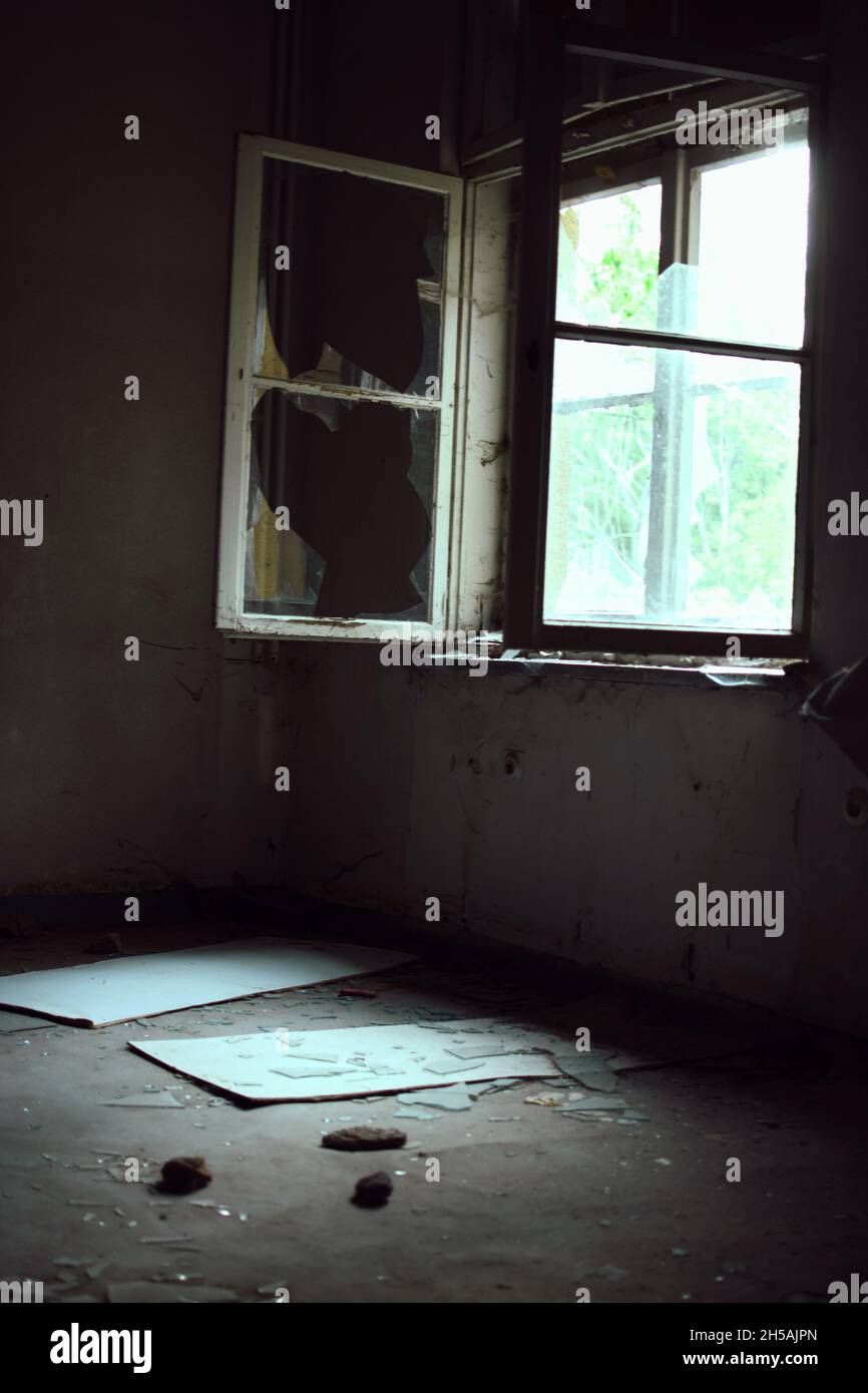 Vertical shot of the inside of an old building with broken windows ...