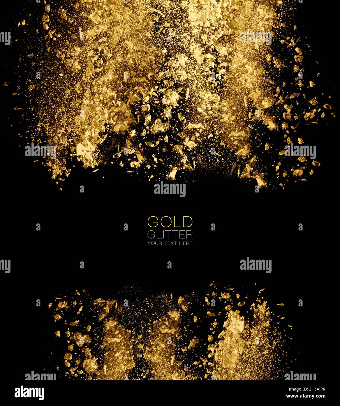 Scattered gold glitter powder on black with central copy space in ...