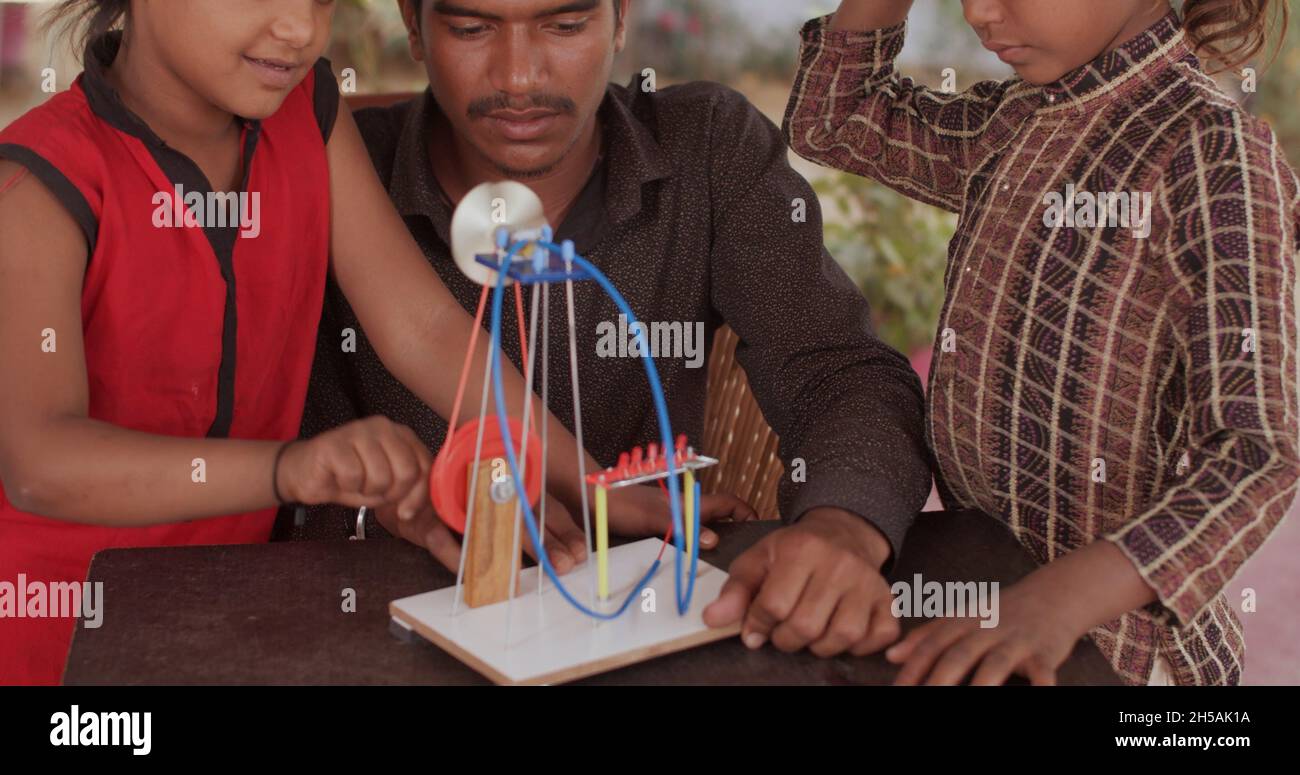 Children learning science and physics using models of wind turbine and ...