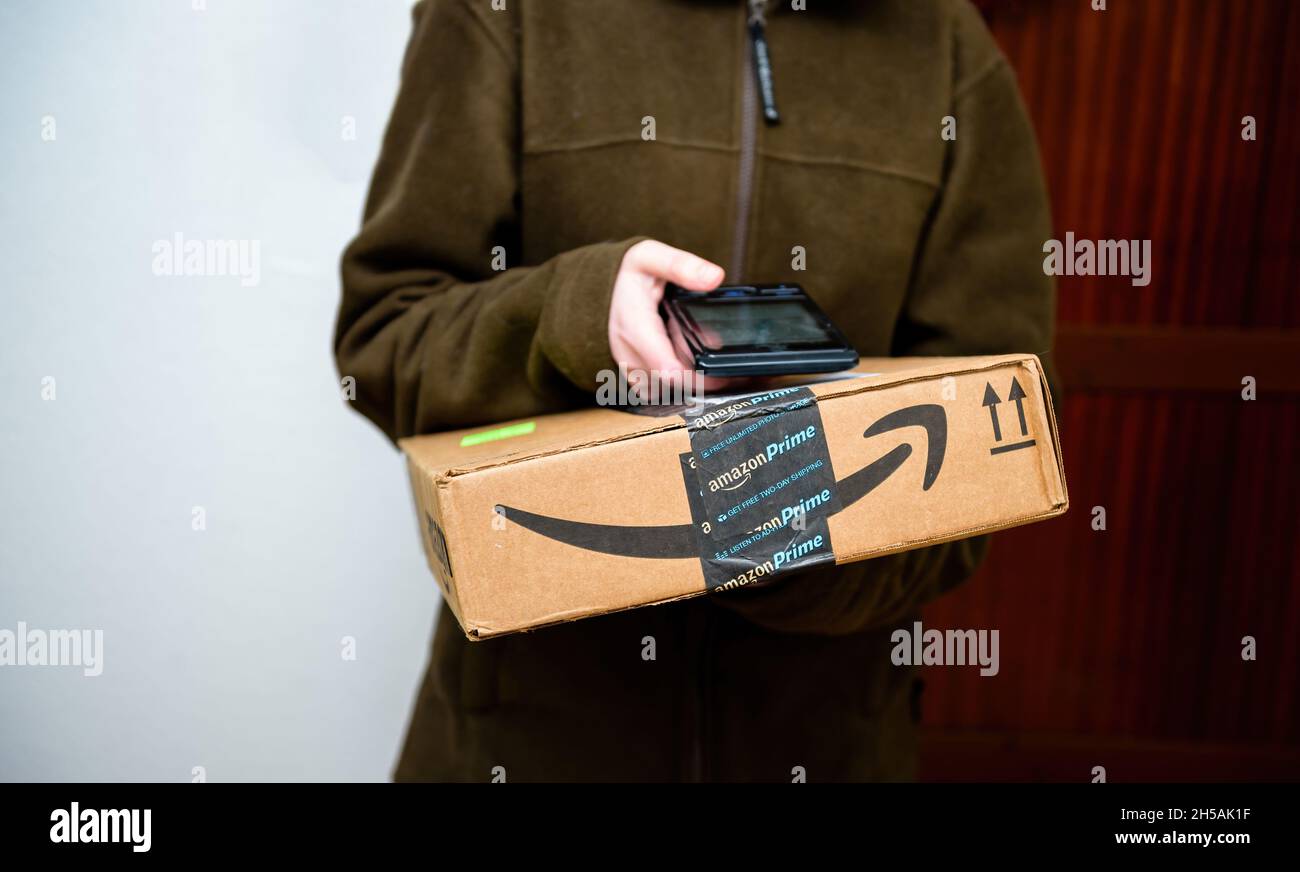 Male silhouette with new Amazon Prime parcel delivery and scanning ...