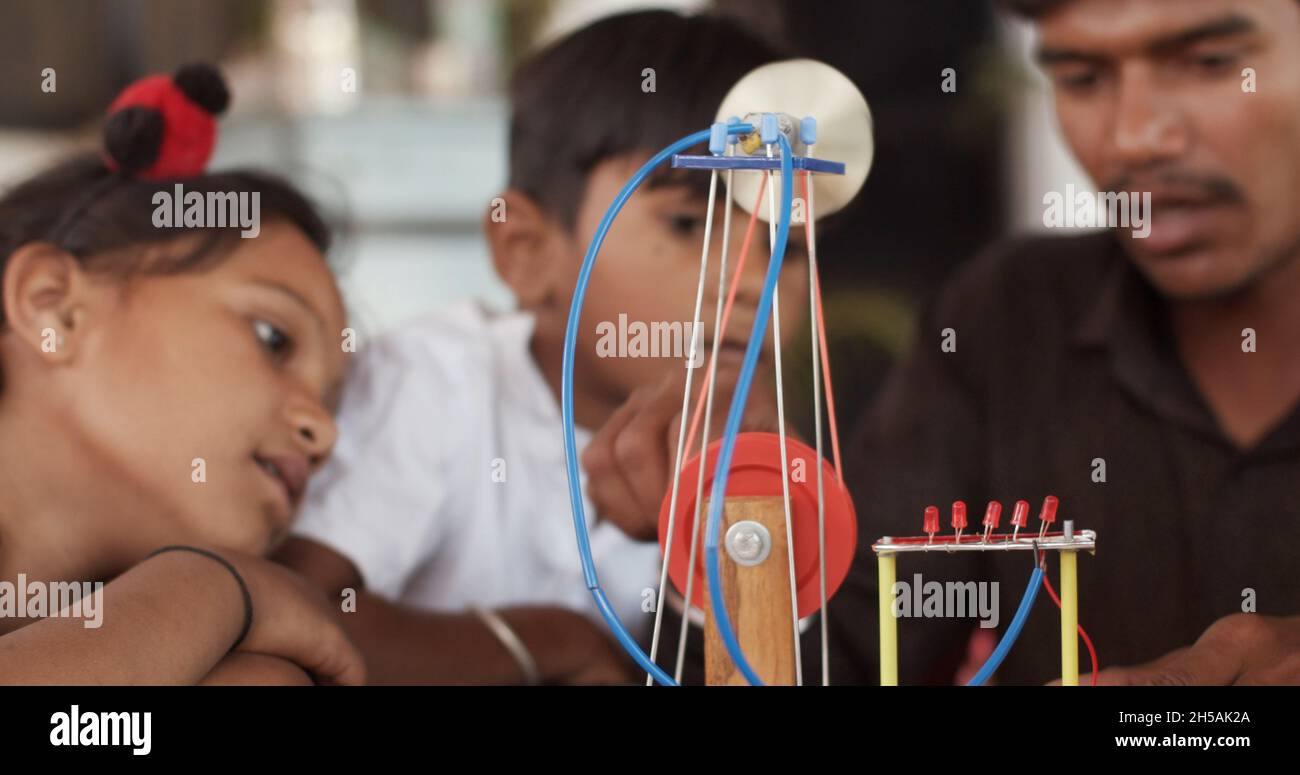 Children learning science and physics using models of wind turbine and ...