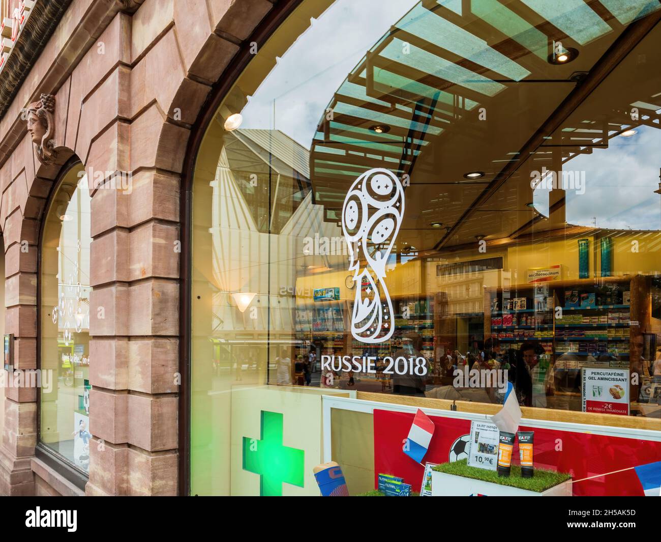 Side view of city and showcase of Drugstore pharmacy in Strasbourg ...
